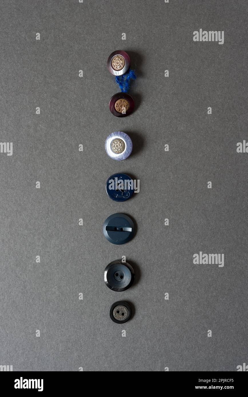 collection of buttons of various forms on blank grey cardboard Stock ...
