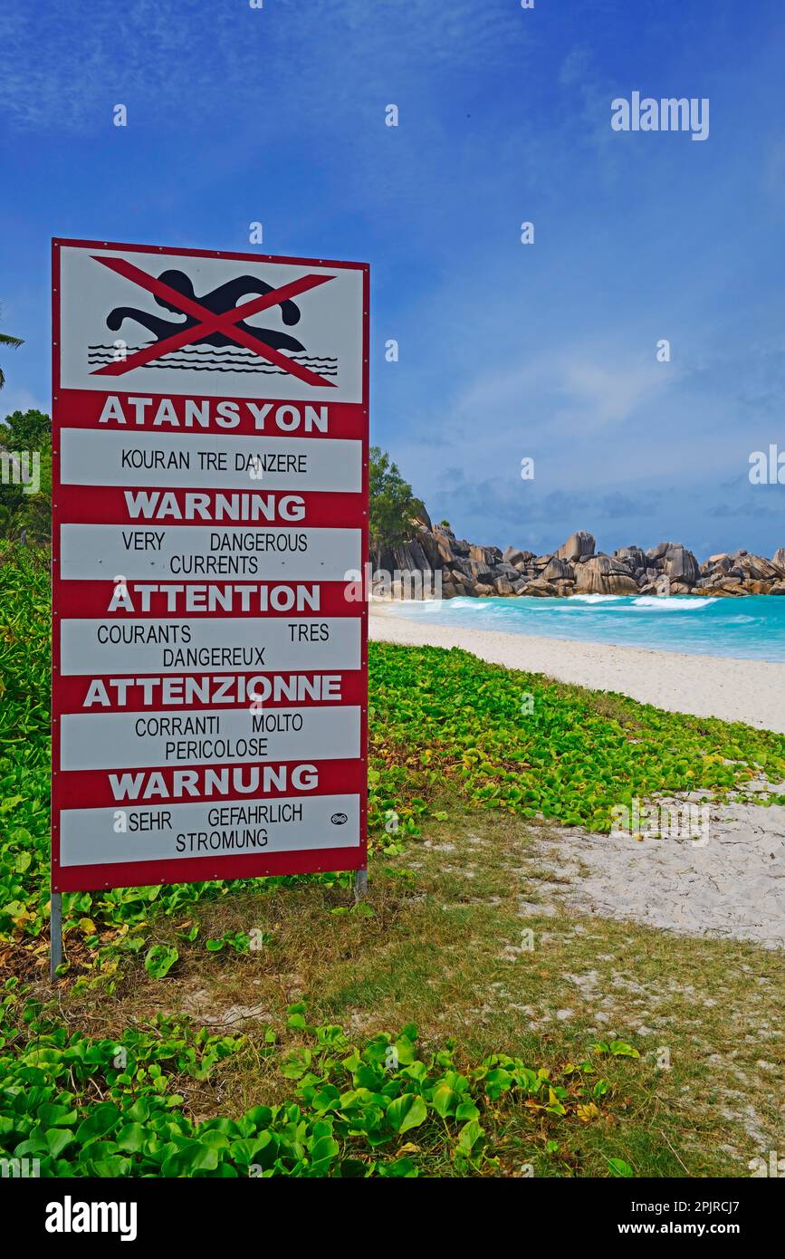 Sign with warnings in different languages about currents, Grand Anse ...