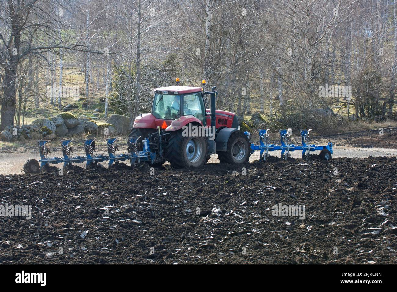 Tractor ploughing with front- and rear-mounted plough, Vastergotland ...