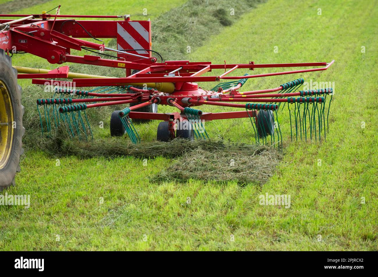 Tedder turning grass hi-res stock photography and images - Alamy