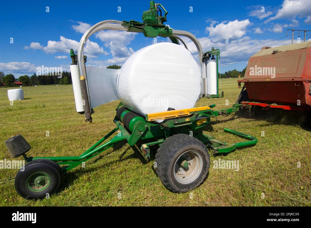 Plastic wrapped silage round bales, wrapped with mechanical bale ...