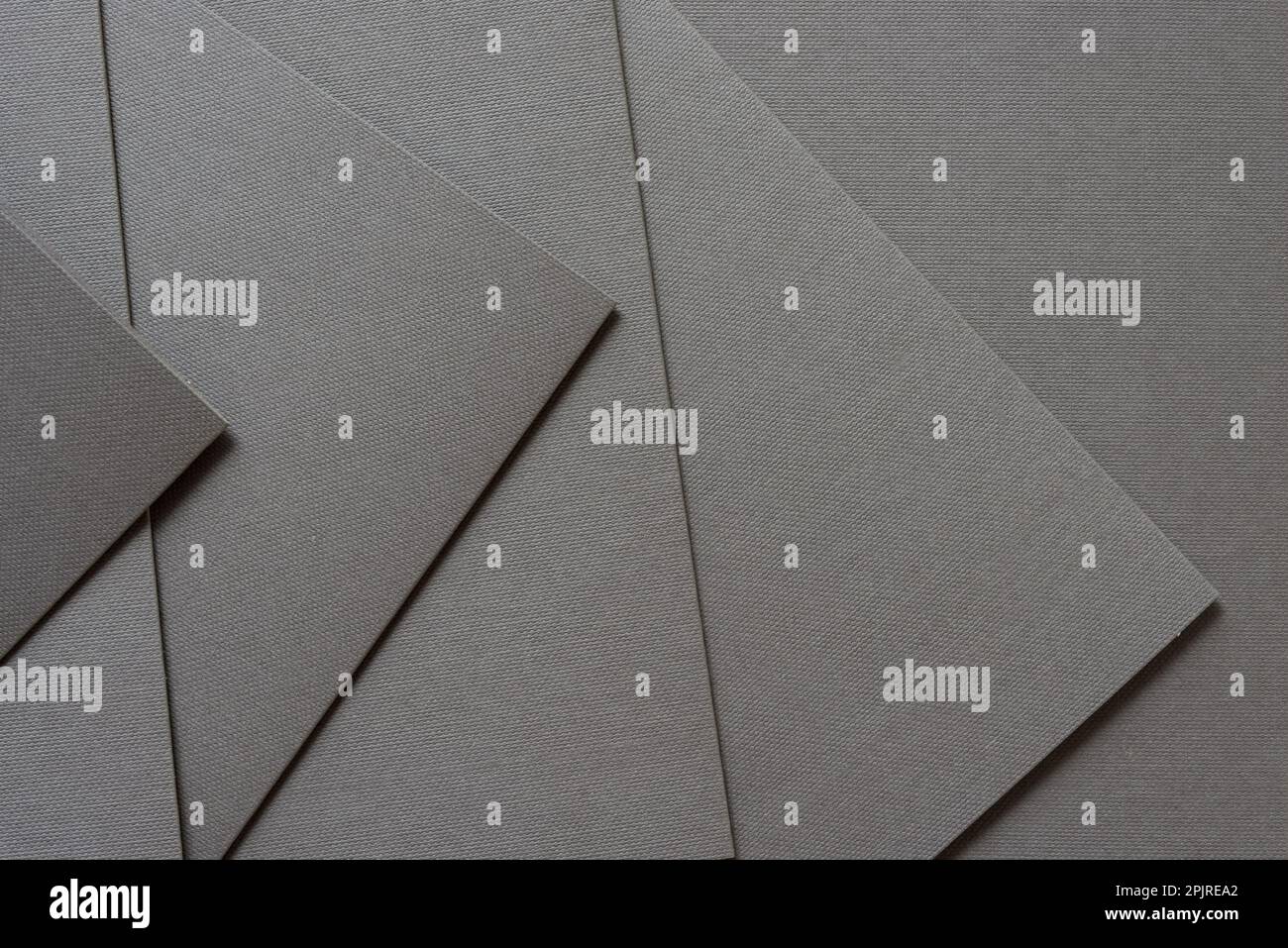 background composed of overlapping dark gray cards with texture Stock ...