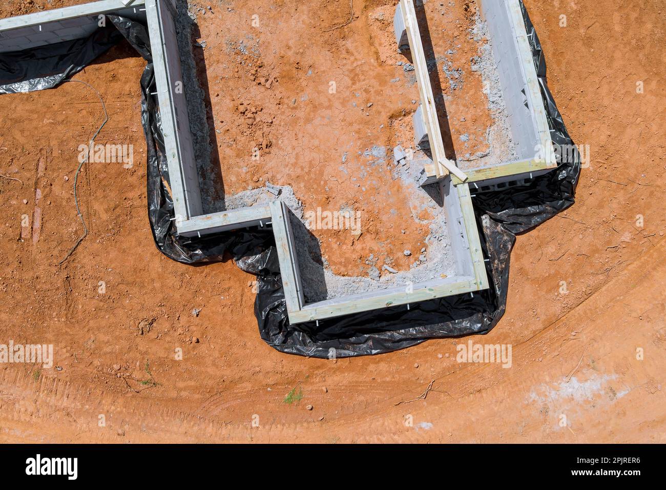 On construction site cement blocks are laid for walls that will support ...