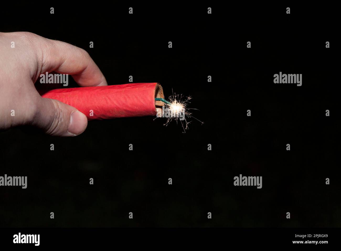 Hand firecracker hi-res stock photography and images - Alamy