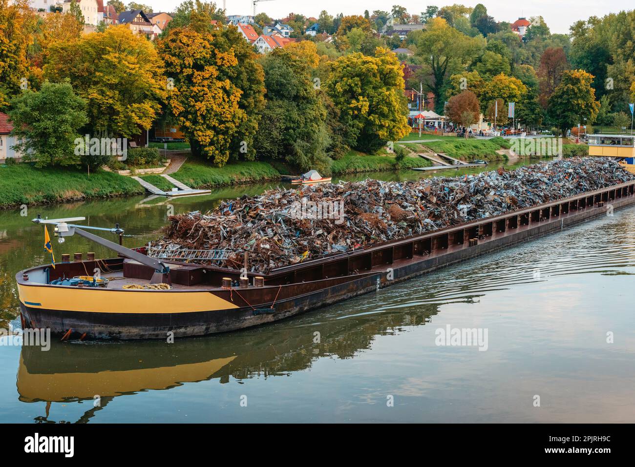 Transportation industry. Ship barge transports scrap metal and sand ...