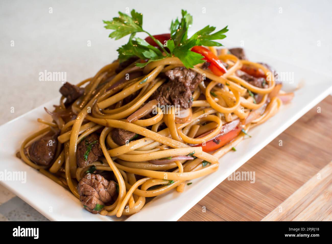 Sauted noodles with lomo saltado sauted beef food gourmet cuisine Peru ...