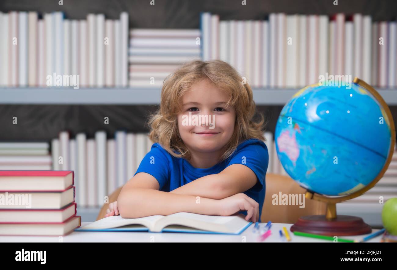 Child pupil reading book in a book store or school library. Kid study ...