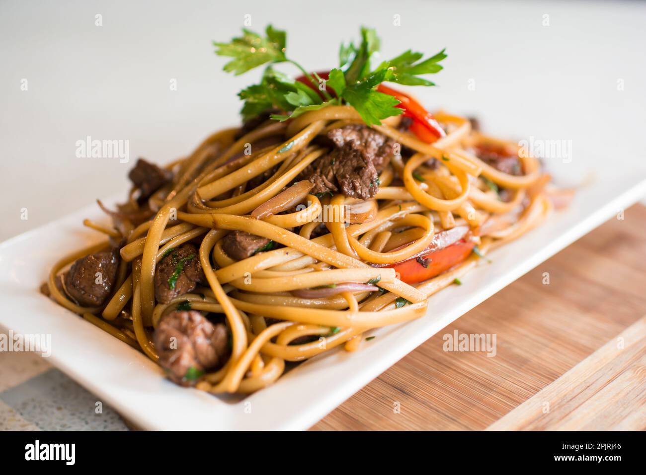 Sauted noodles with lomo saltado sauted beef food gourmet cuisine Peru ...