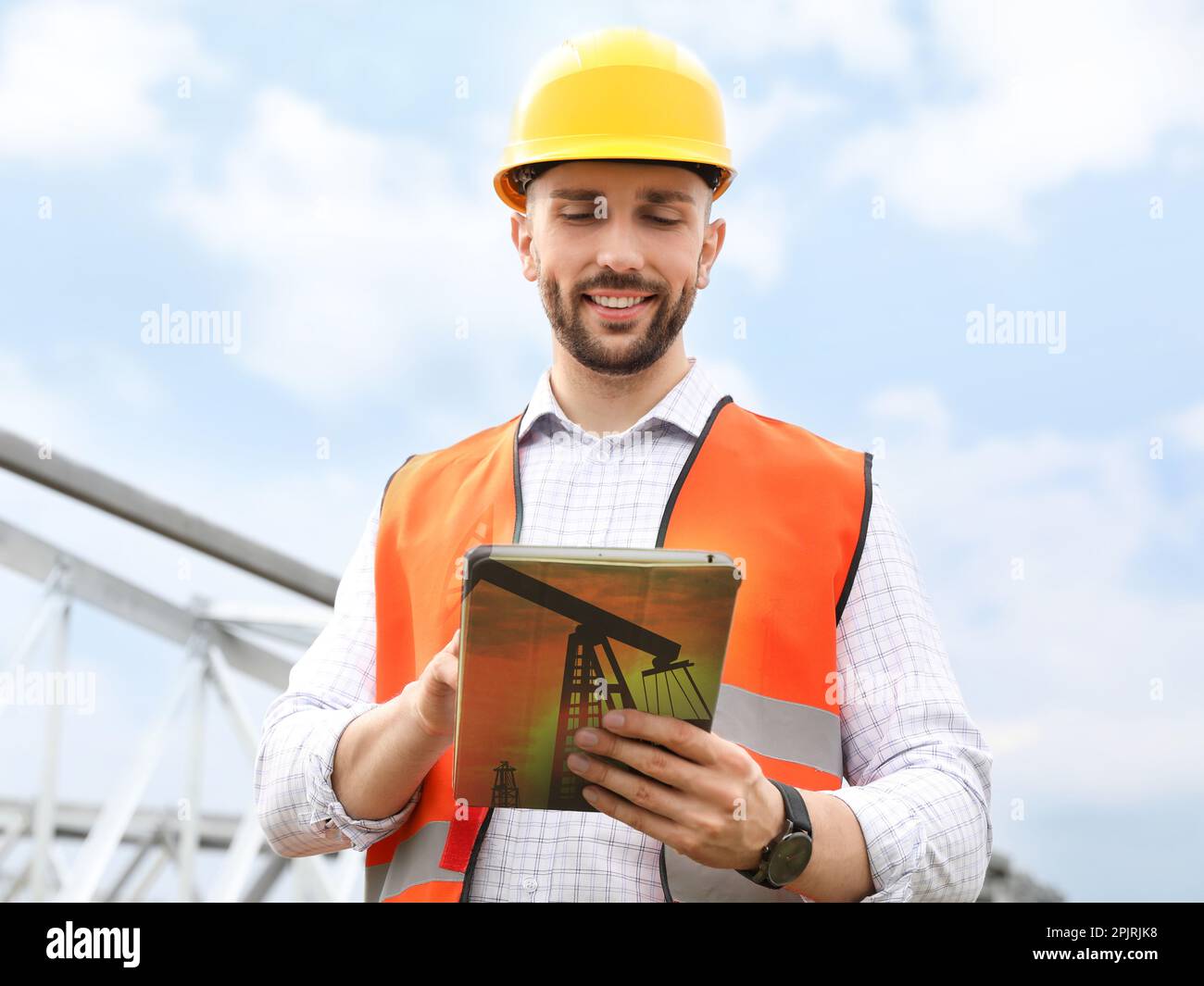 Professional engineer wearing uniform with tablet outdoors Stock Photo ...