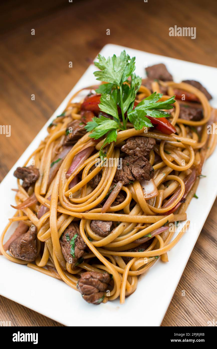 Sauted noodles with lomo saltado sauted beef food gourmet cuisine Peru ...