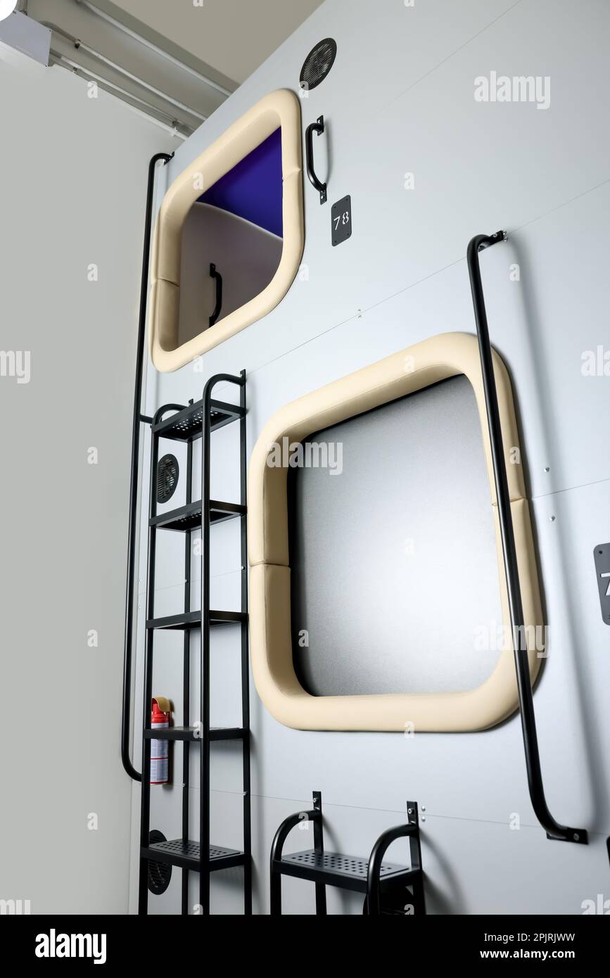 Capsules in modern pod hostel. Stylish interior Stock Photo - Alamy