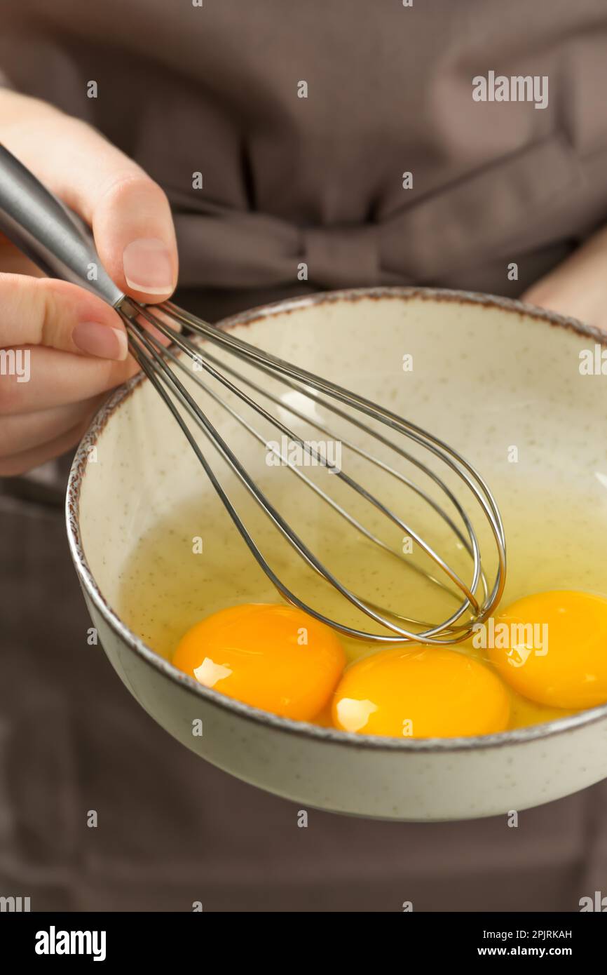 Cooking process woman whisking eggs hi-res stock photography and images ...