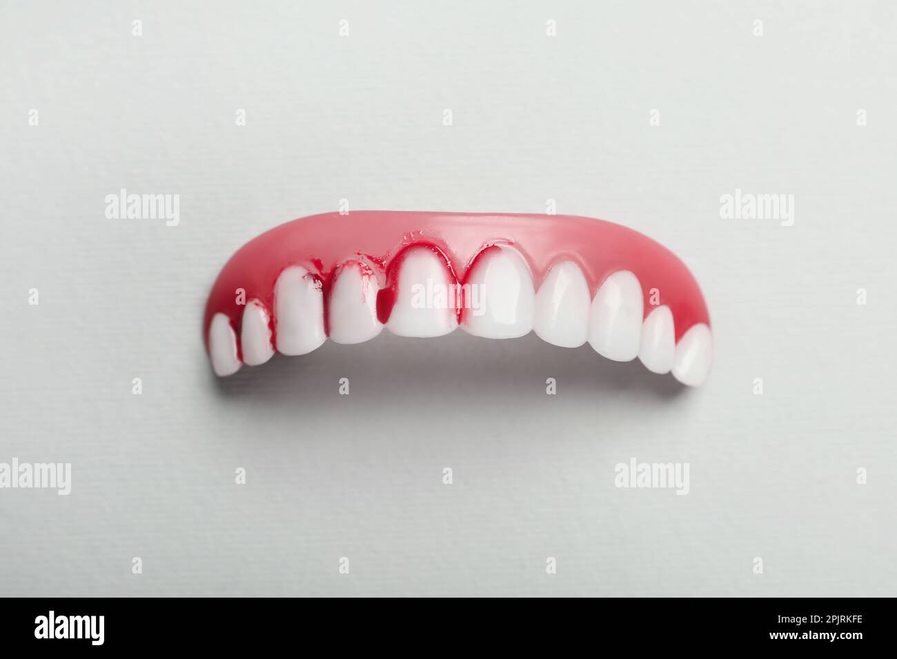 Gum model with blood on teeth against white background, top view Stock ...