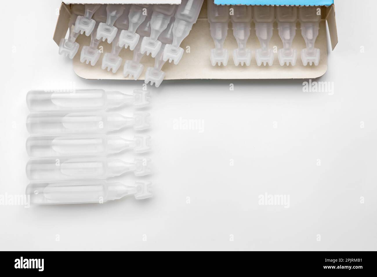 Single dose ampoules of sterile isotonic sea water solution on white ...