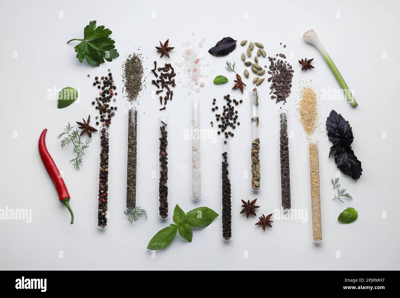 Flat lay composition with various spices, test tubes and fresh herbs on ...