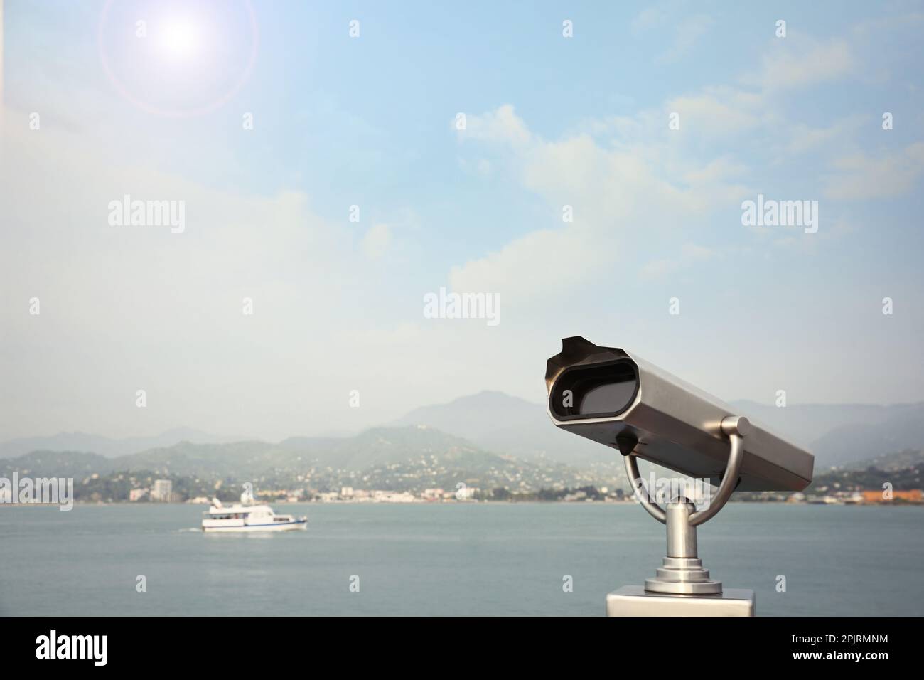 Metal tower viewer installed near sea, space for text. Mounted ...