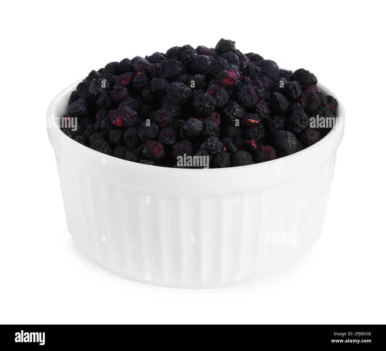 Freeze dried blueberries in bowl on white background Stock Photo - Alamy