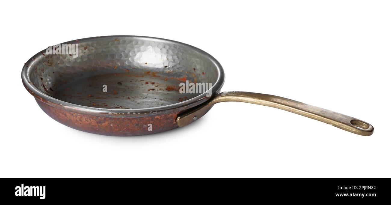 Dirty old frying pan isolated on white Stock Photo - Alamy