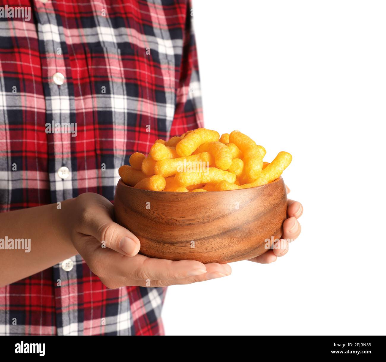 Woman holding bowl of crunchy cheesy corn sticks on white background ...