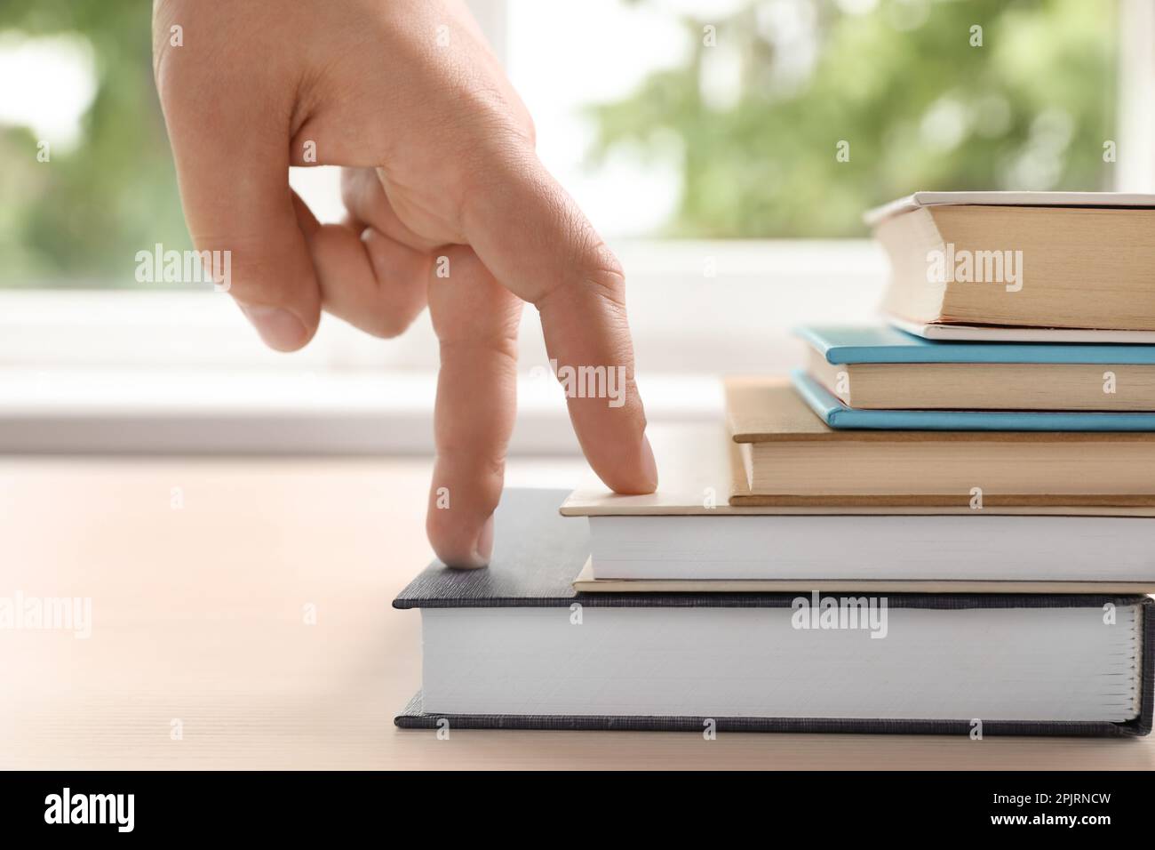 Woman stepping up fingers hi-res stock photography and images - Alamy