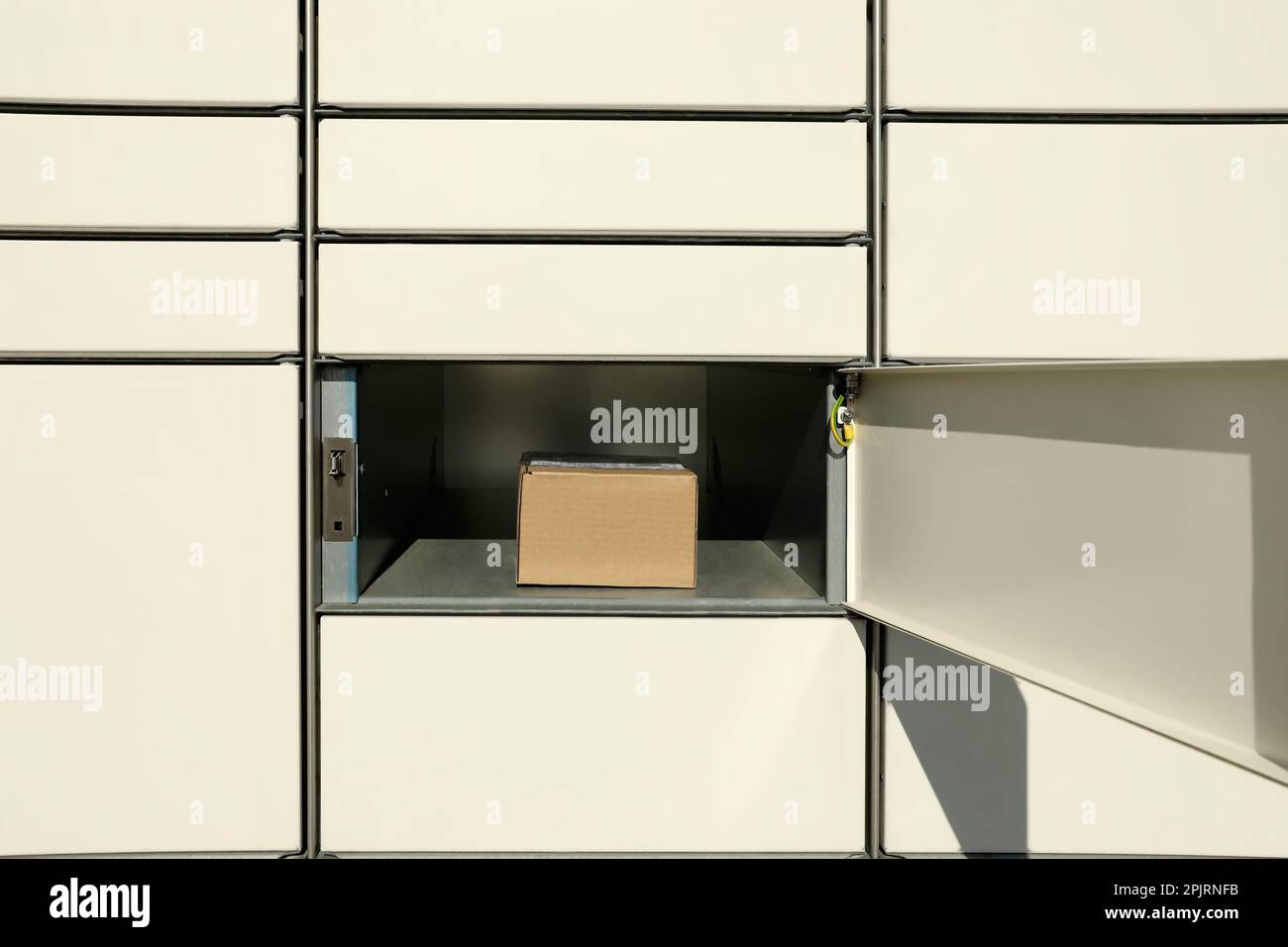 Open box with package in parcel locker Stock Photo - Alamy