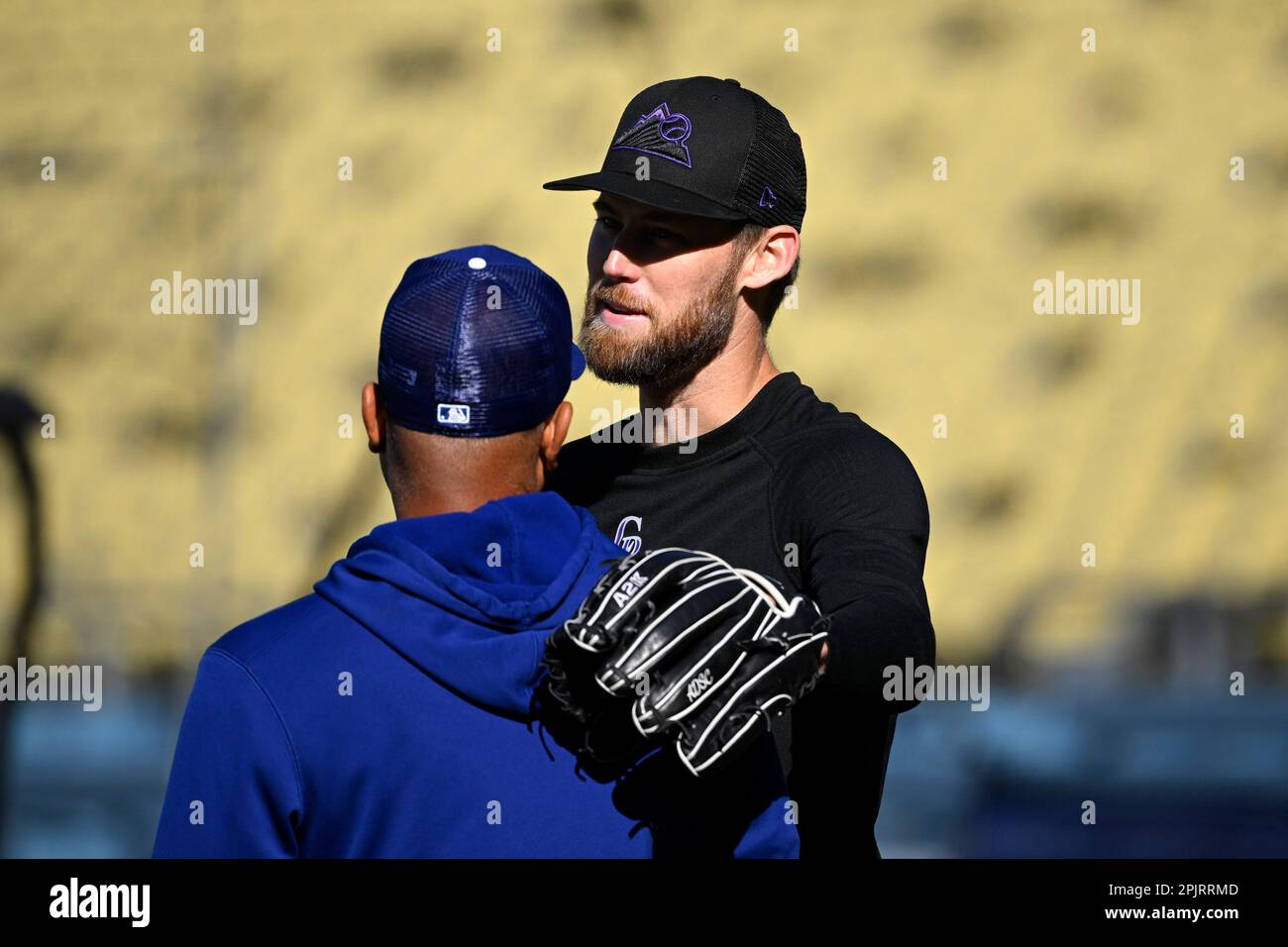 Los Angeles Dodgers manager Dave Roberts, left, talks with Colorado ...