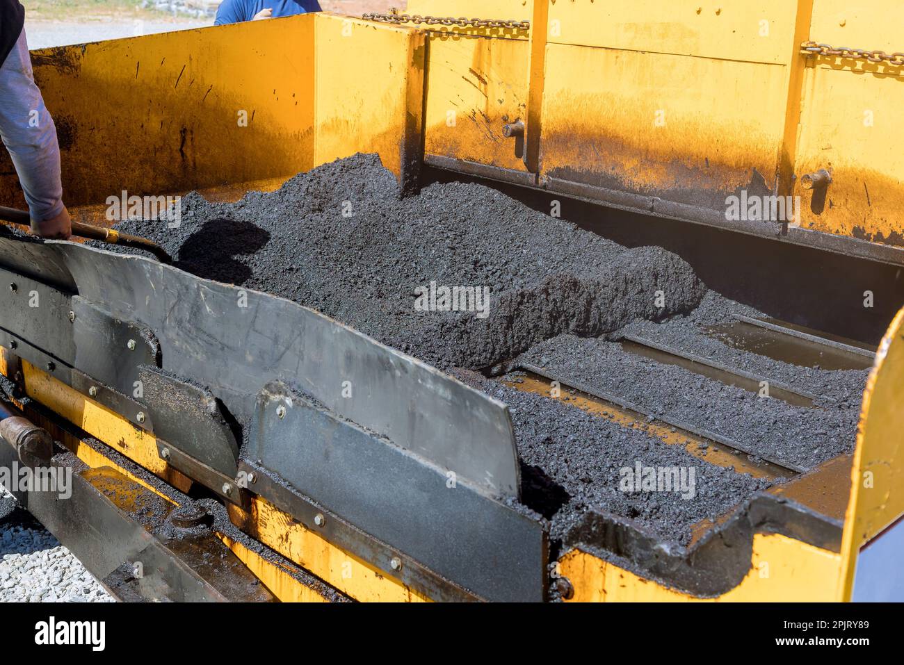 When laying new asphalt roads in layering process an asphalt paver ...