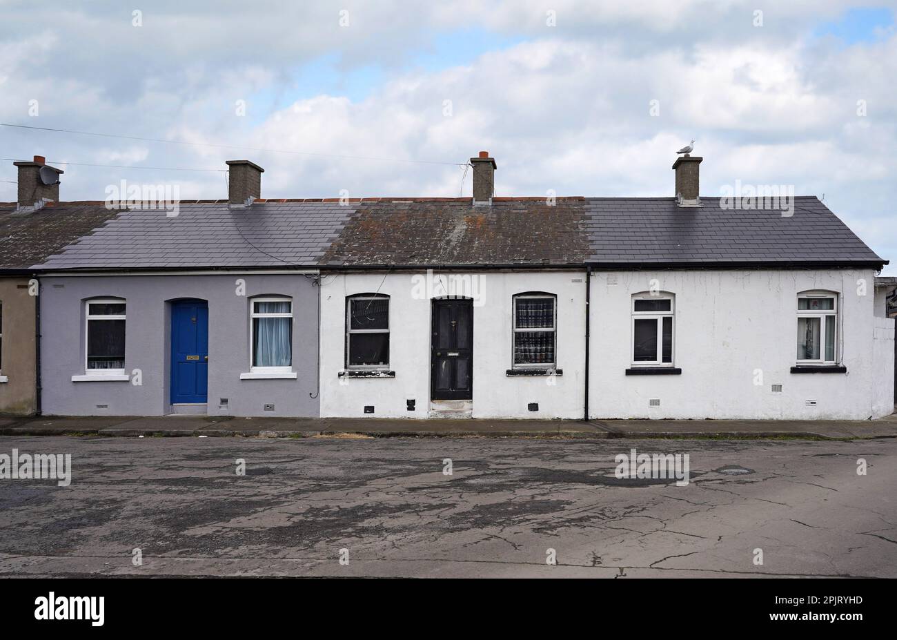 Row of small working class one story houses Stock Photo - Alamy