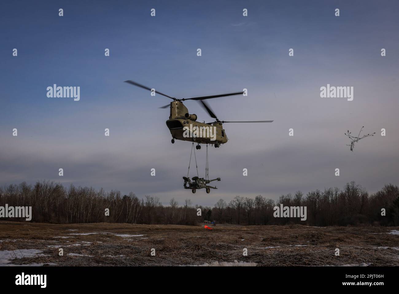 A U.S. Army Boeing CH-47 Chinook prepares to drop a M777 towed 155 mm ...