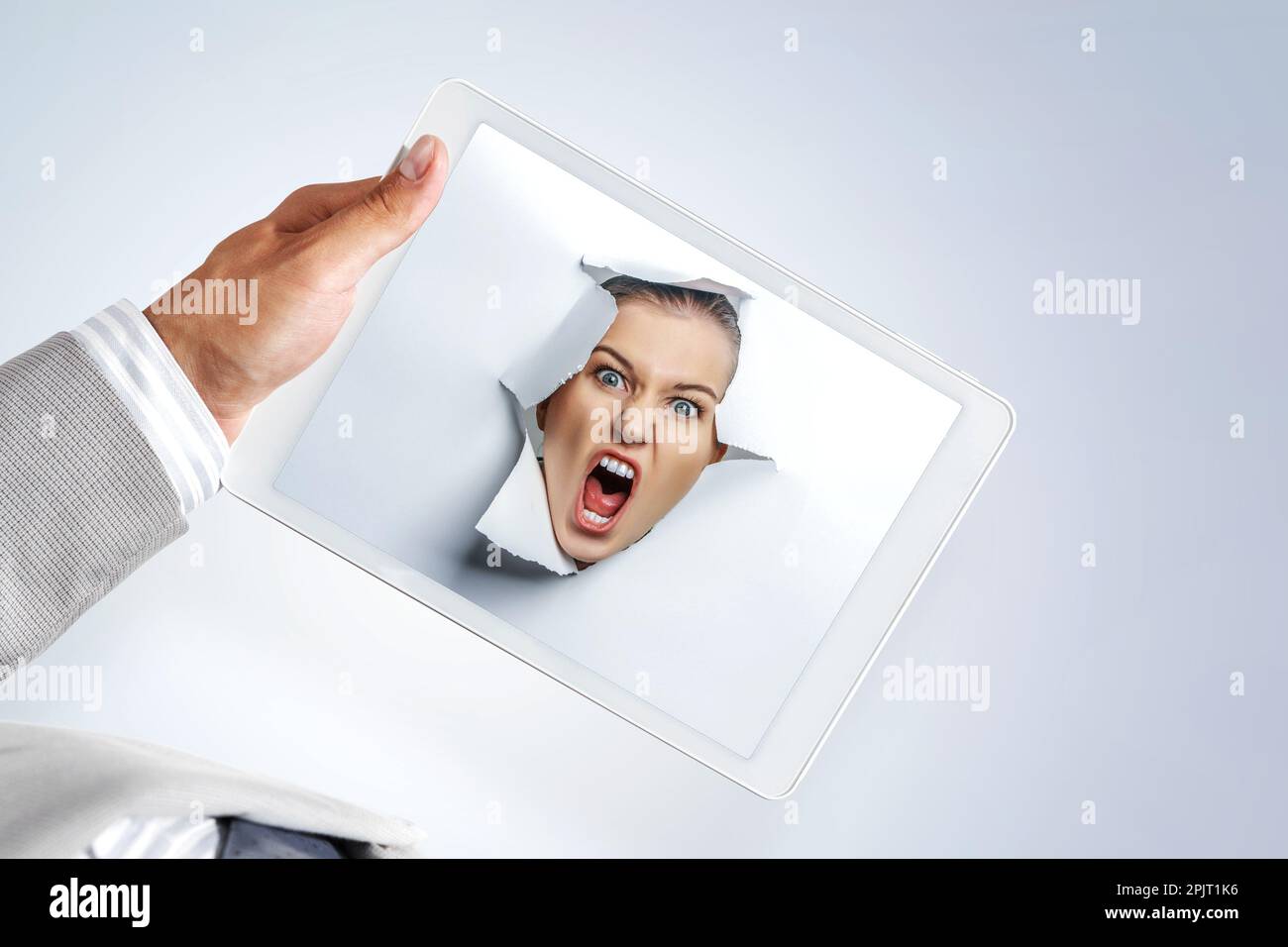 Female face through the hole in paper Stock Photo - Alamy
