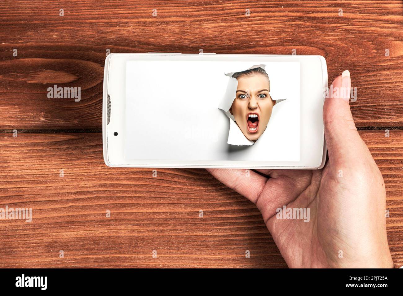 Female face through the hole in paper Stock Photo - Alamy