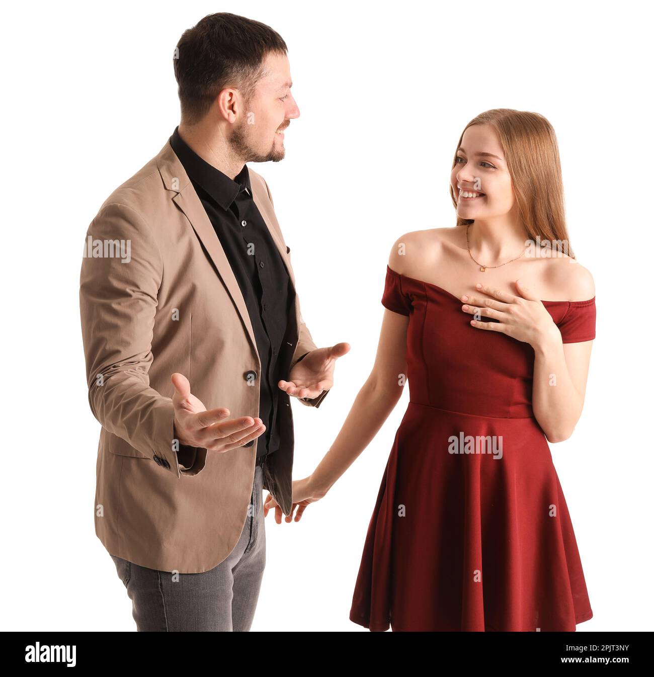 Young man letting his wife go first on white background Stock Photo - Alamy