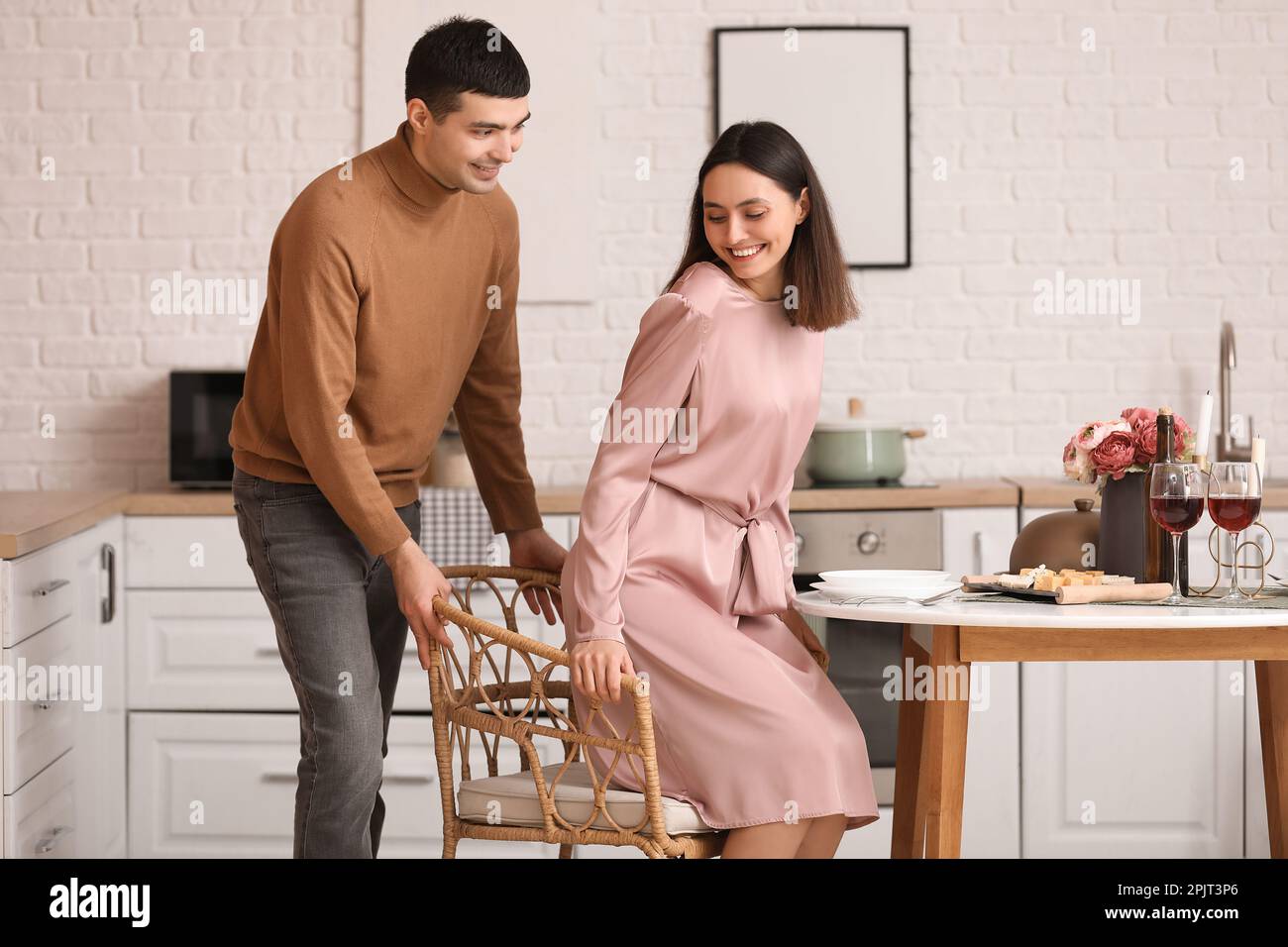 Man chair woman pulling hi-res stock photography and images - Alamy