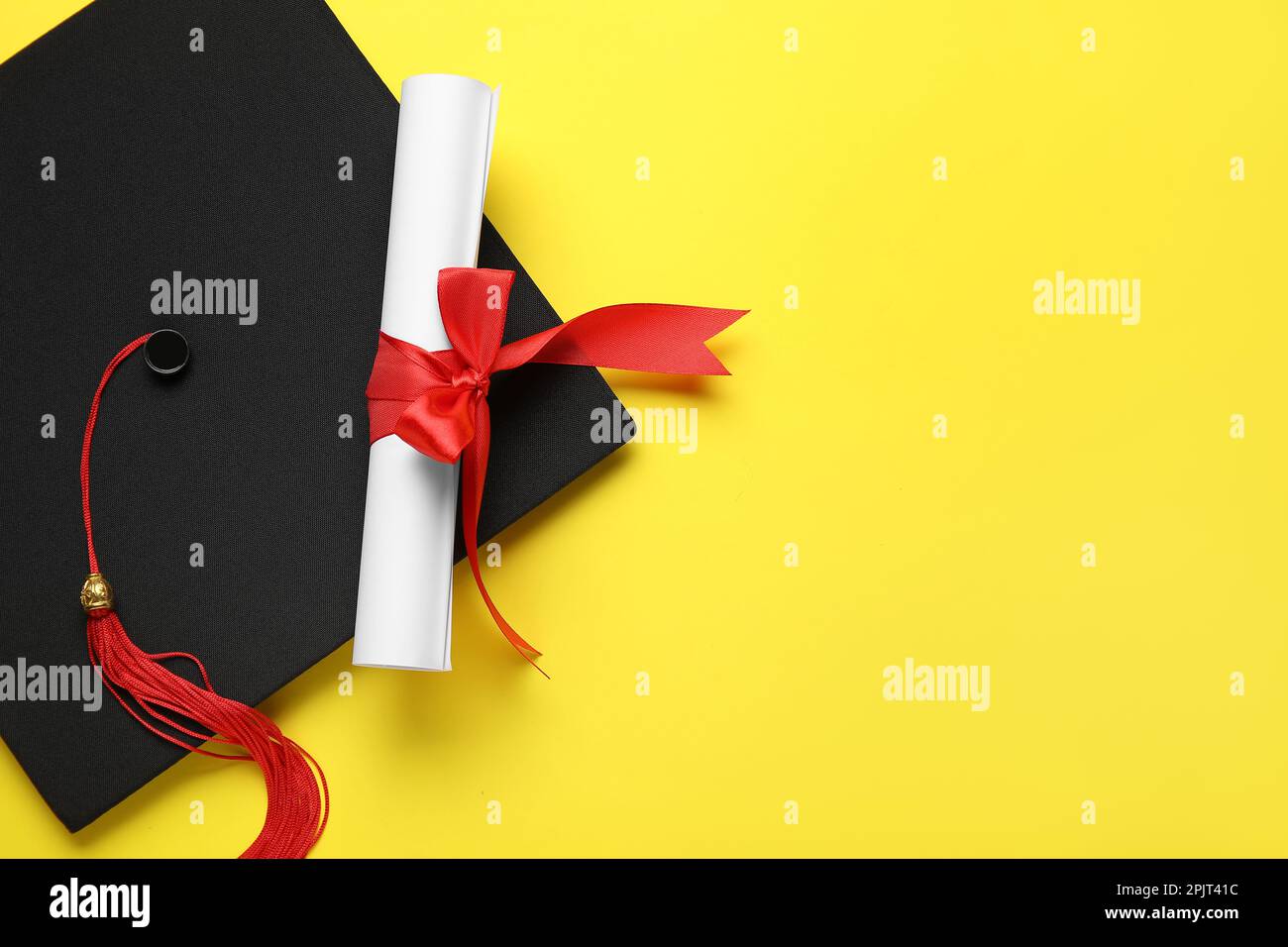 Diploma with red ribbon and graduation hat on yellow background Stock ...