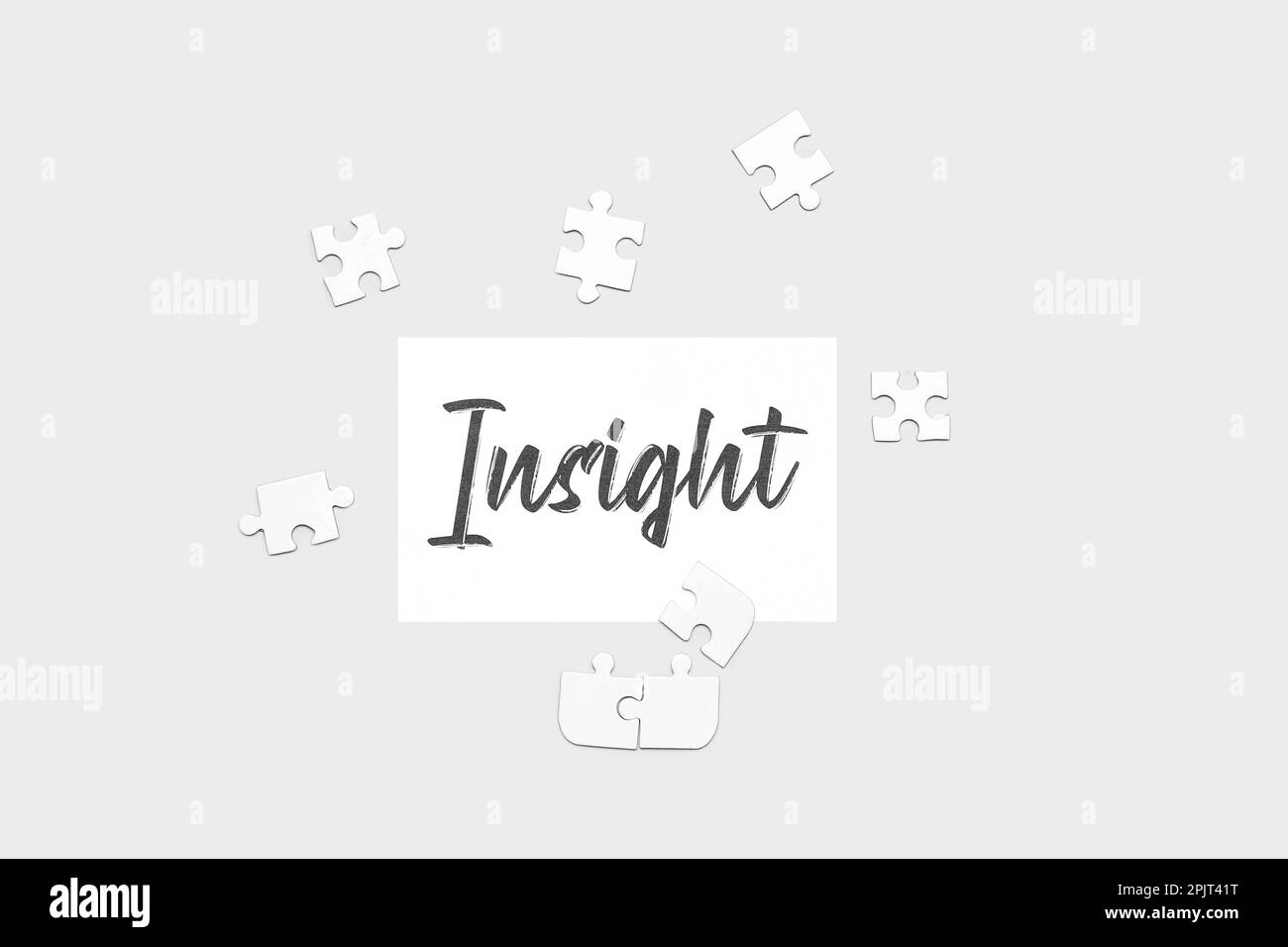 Paper with word INSIGHT and puzzle pieces on light background Stock ...