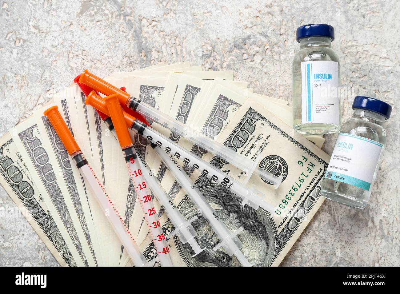 Insulin with syringes and money on grunge background. Expensive ...