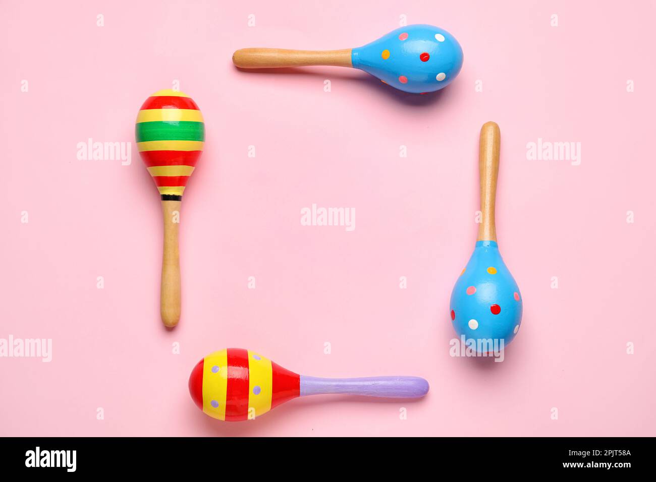 Frame made of Mexican maracas on pink background Stock Photo - Alamy