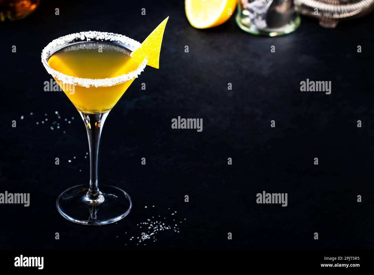 Yellow bird cocktail with white rum, liquor and lime juice in martini ...