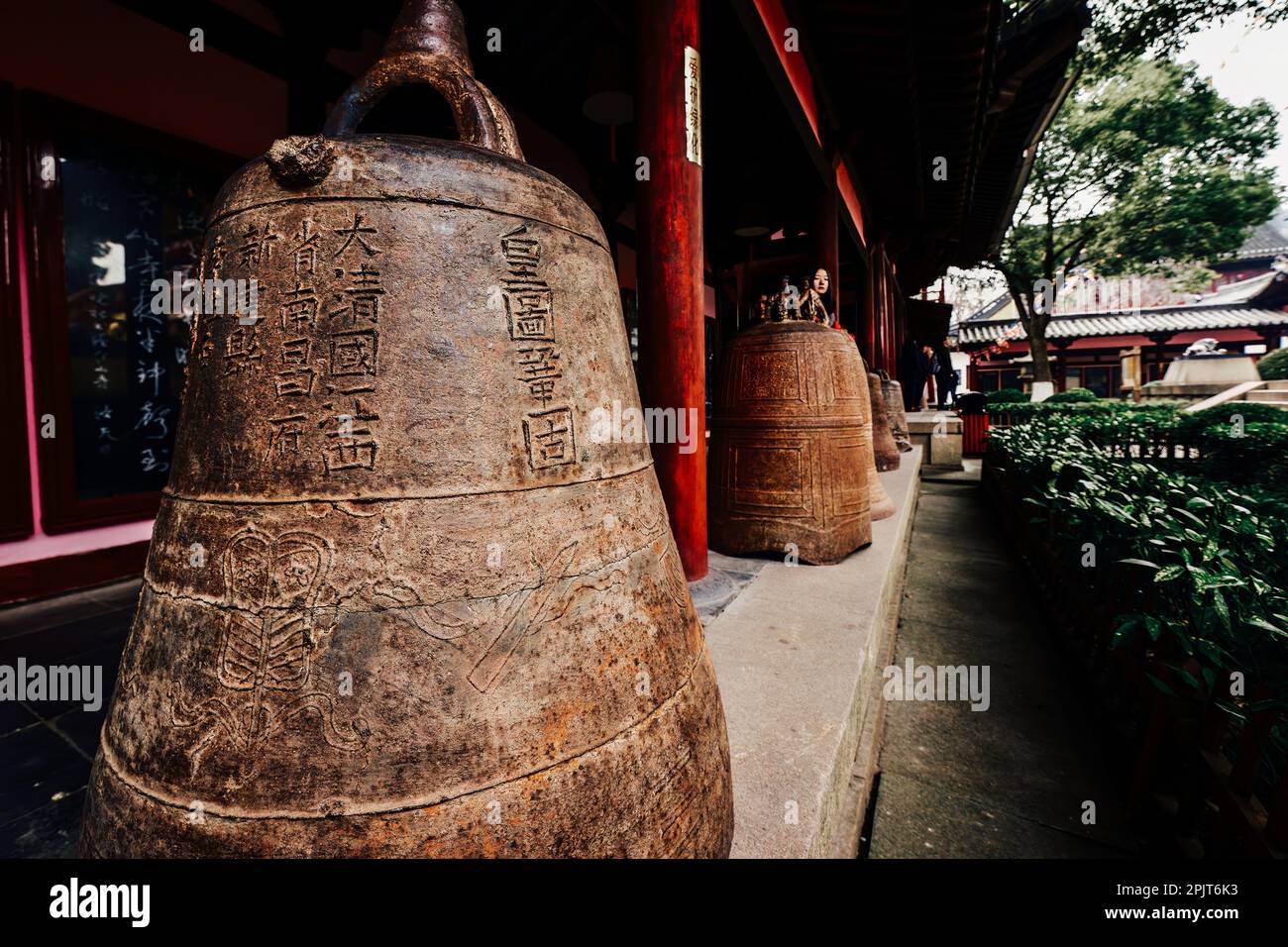 The giant bell in a famous temple in Zhejiang, China, is full of ...