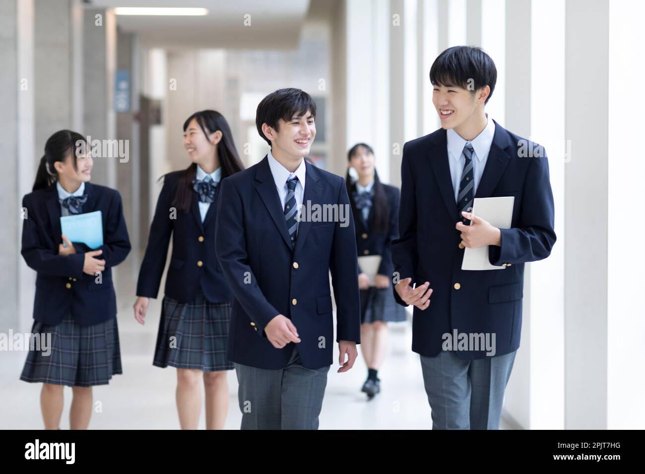 School boy walking out of school hi-res stock photography and images ...