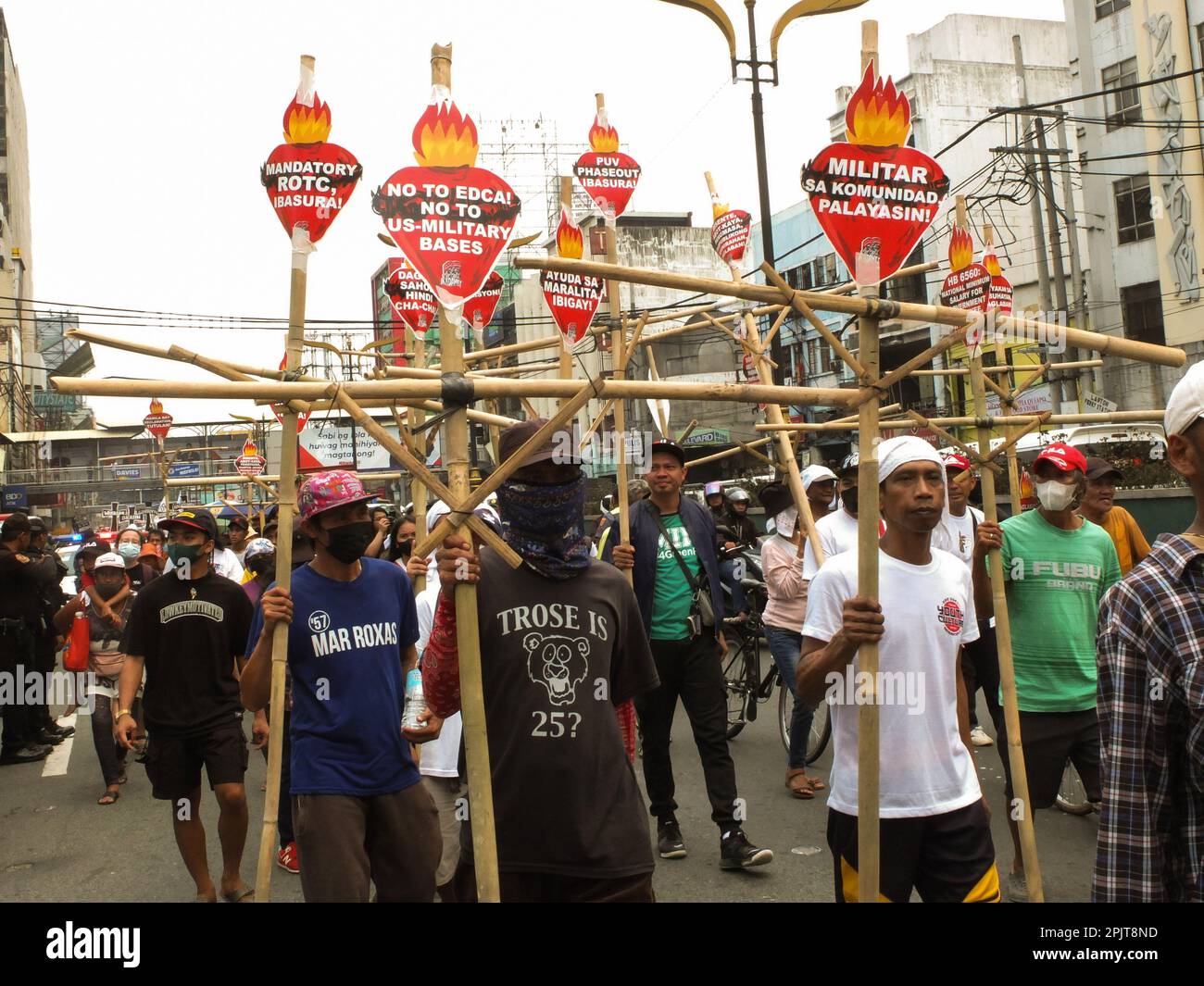 Manila, Philippines. 03rd Apr, 2023. Protesters hold bamboo crosses ...