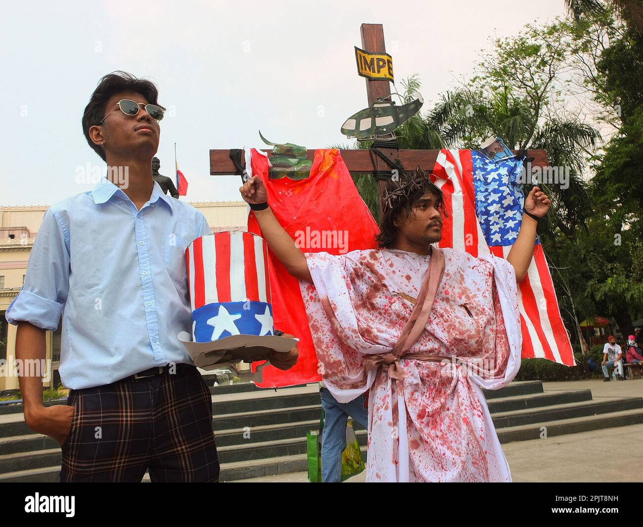 Manila, Philippines. 03rd Apr, 2023. A protester holds an Uncle Sam's ...