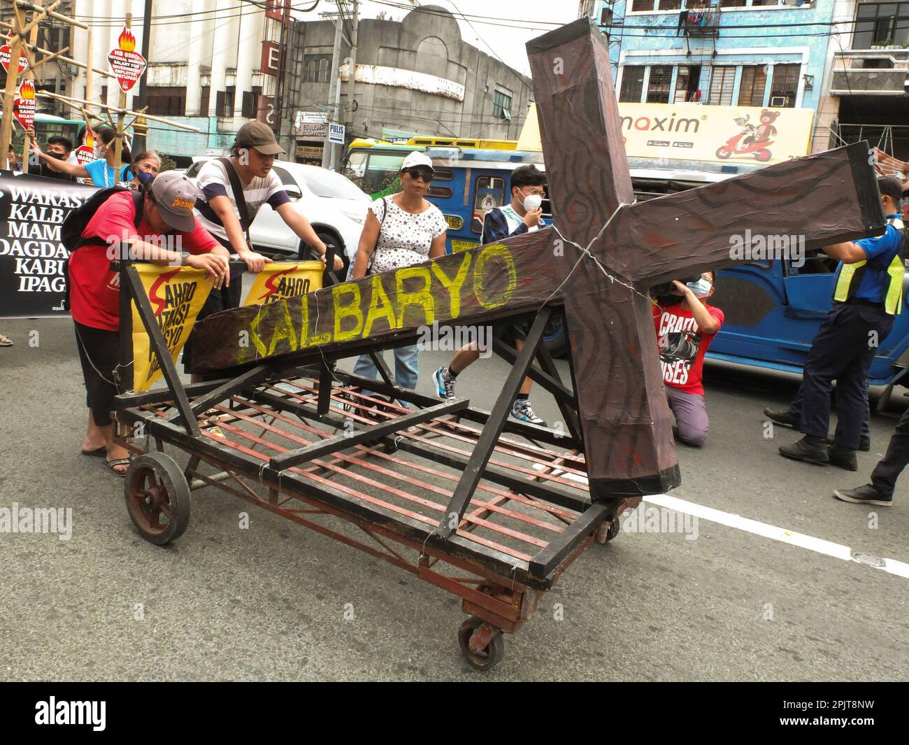 Manila, Philippines. 03rd Apr, 2023. Protesters seen pushing their cart ...
