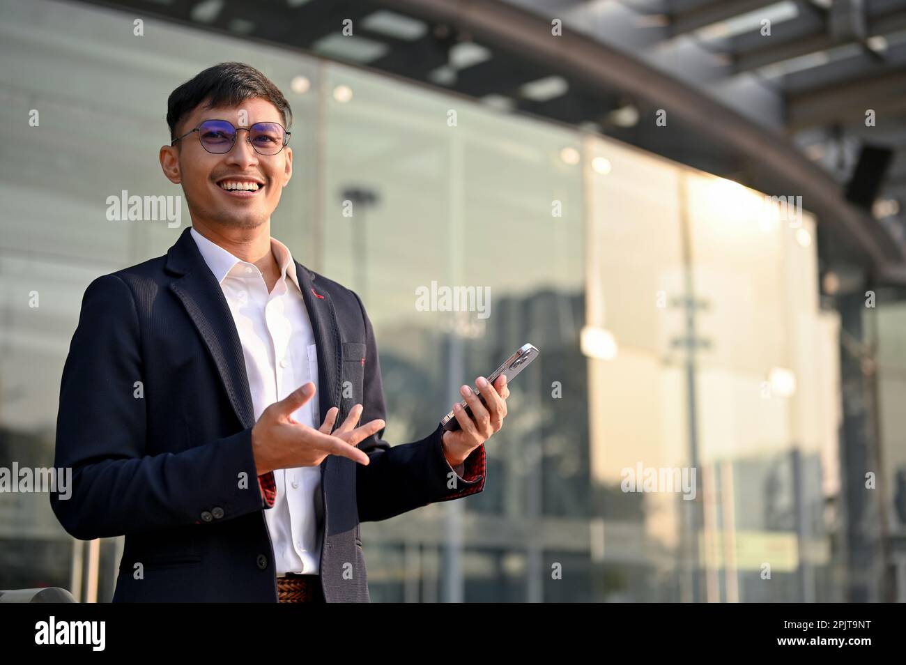 Successful and confident millennial Asian businessman or male executive ...