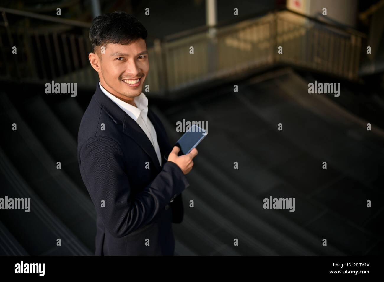 Handsome and successful millennial Asian businessman or male banker in ...