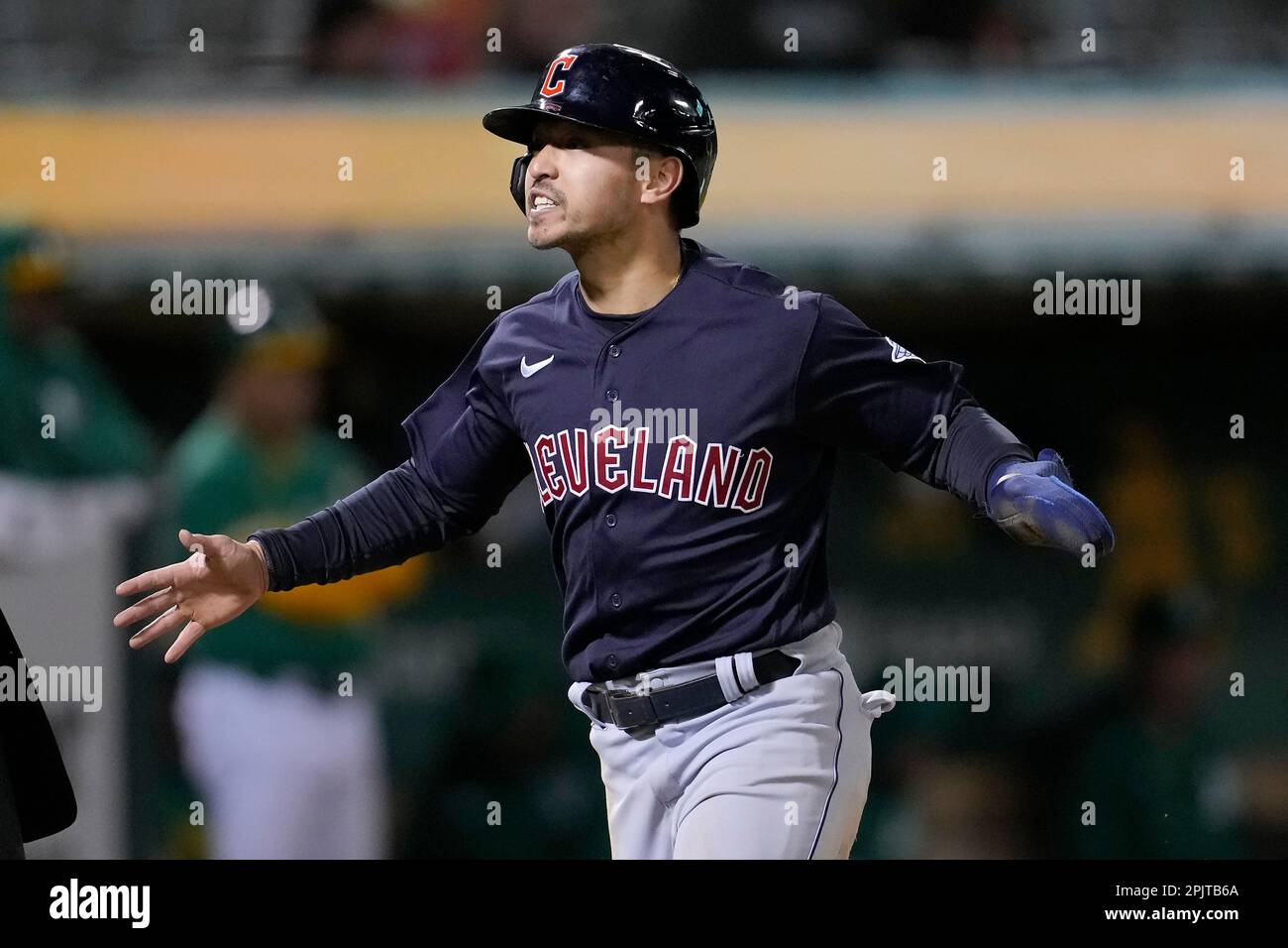 Cleveland Guardians' Steven Kwan reacts after scoring against the ...