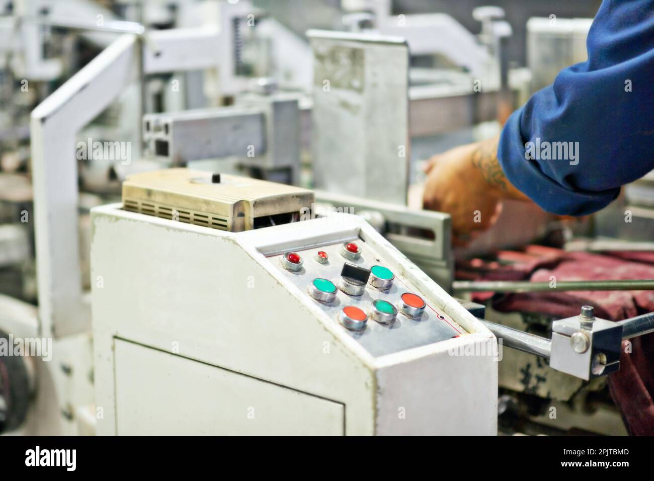 Keeping it all running smoothly. Cropped image of a factory worker ...