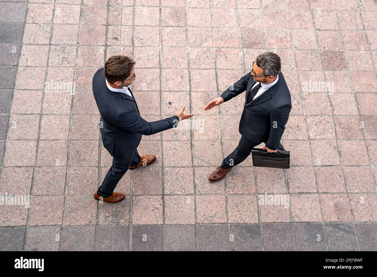 Business man shaking hands. Two businessmen handshake outdoor ...