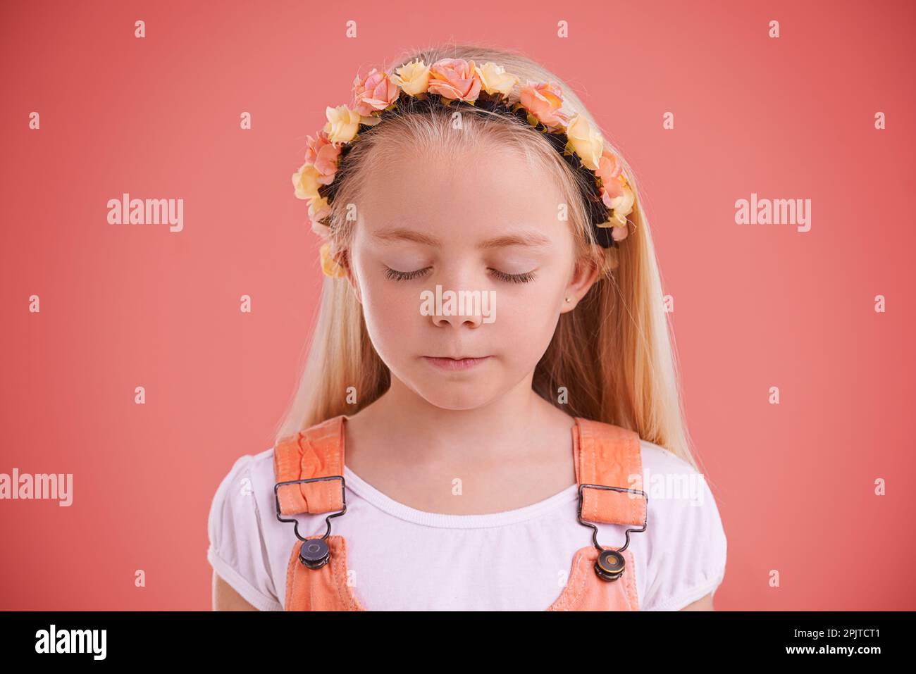 Sweet little flower princess. a sweet young girl wearing a flower crown ...