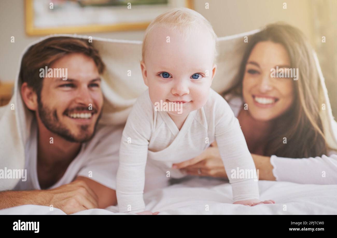 My parents and me. a young couple and their baby daughter in the ...